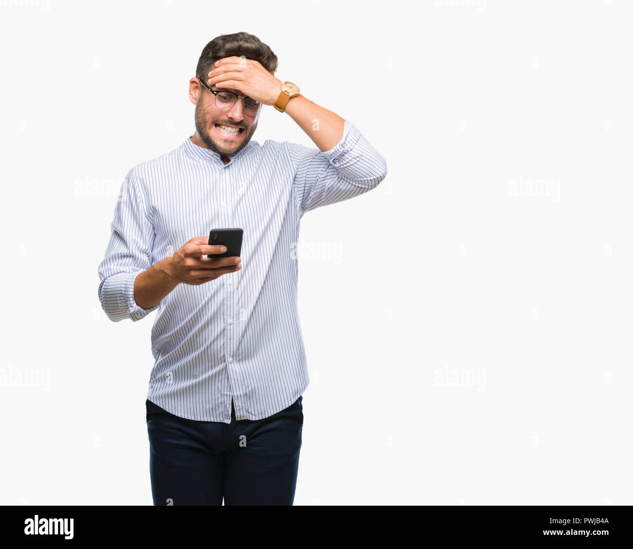 Young handsome man texting using smartphone over isolated background ...