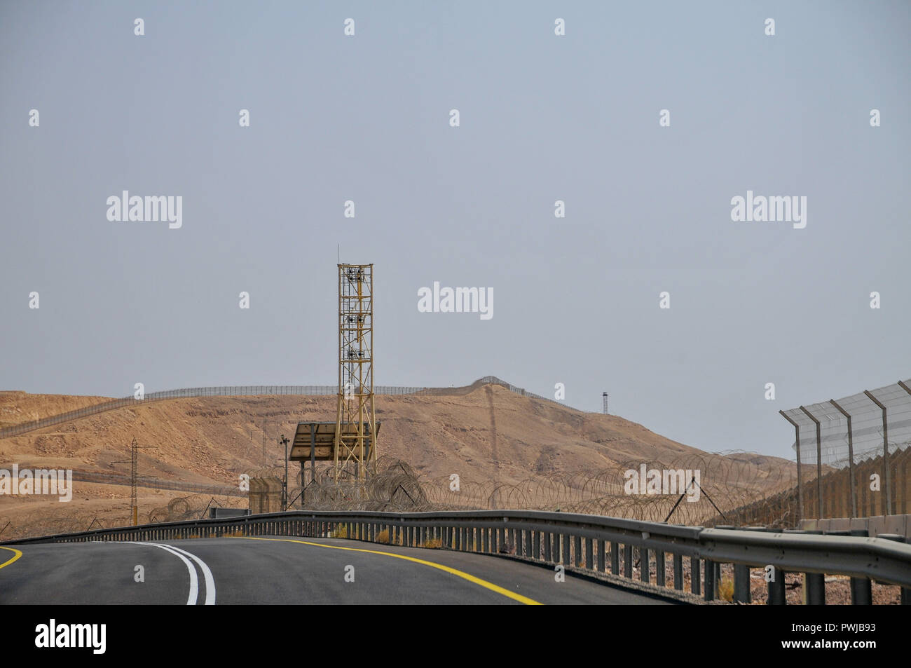 Border fence road hi-res stock photography and images - Alamy