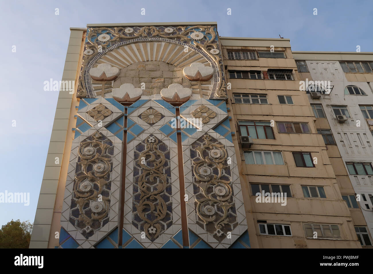 A Soviet era mosaic depicting cotton motif decorates facade of an ...