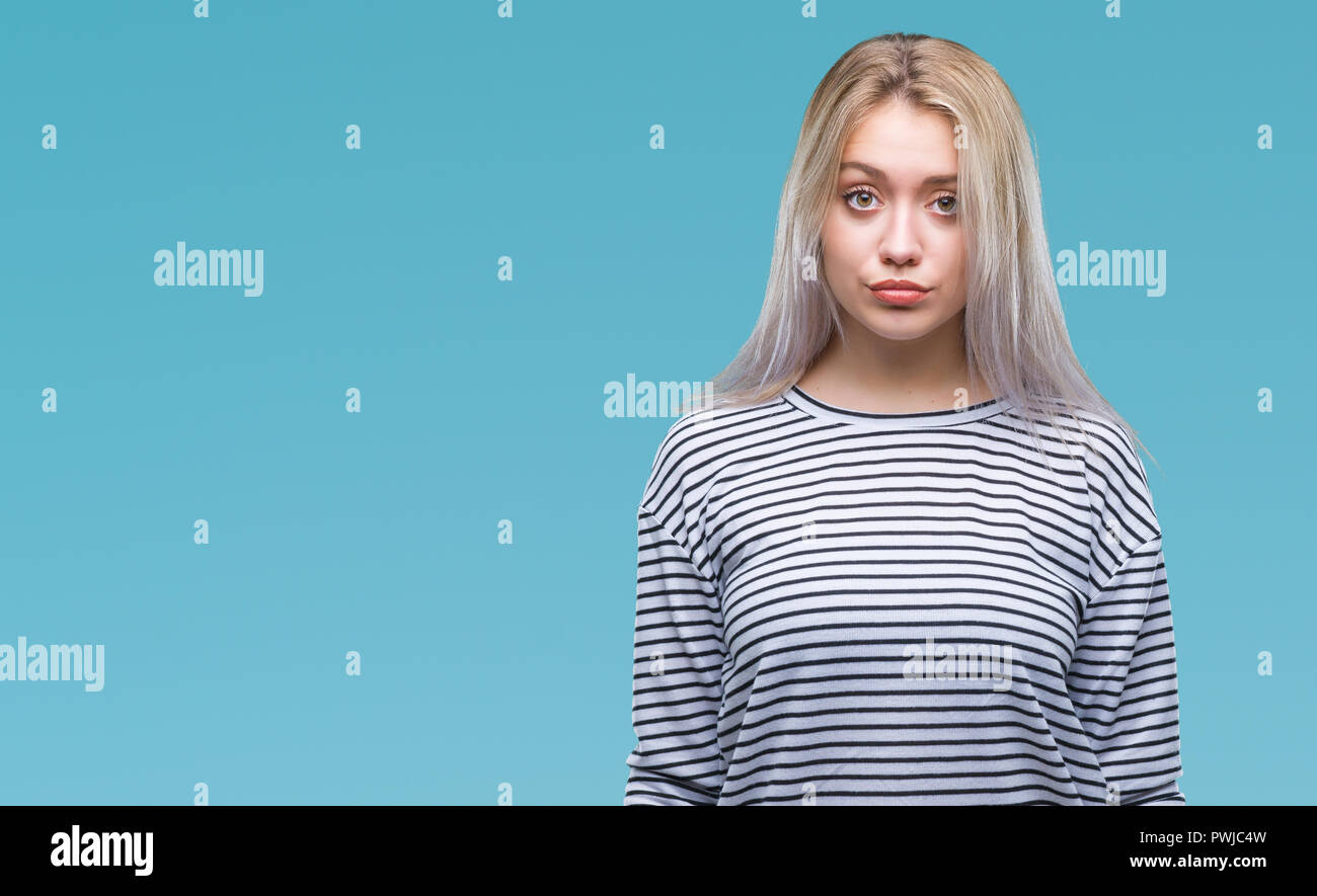 Young blonde woman over isolated background depressed and worry for ...