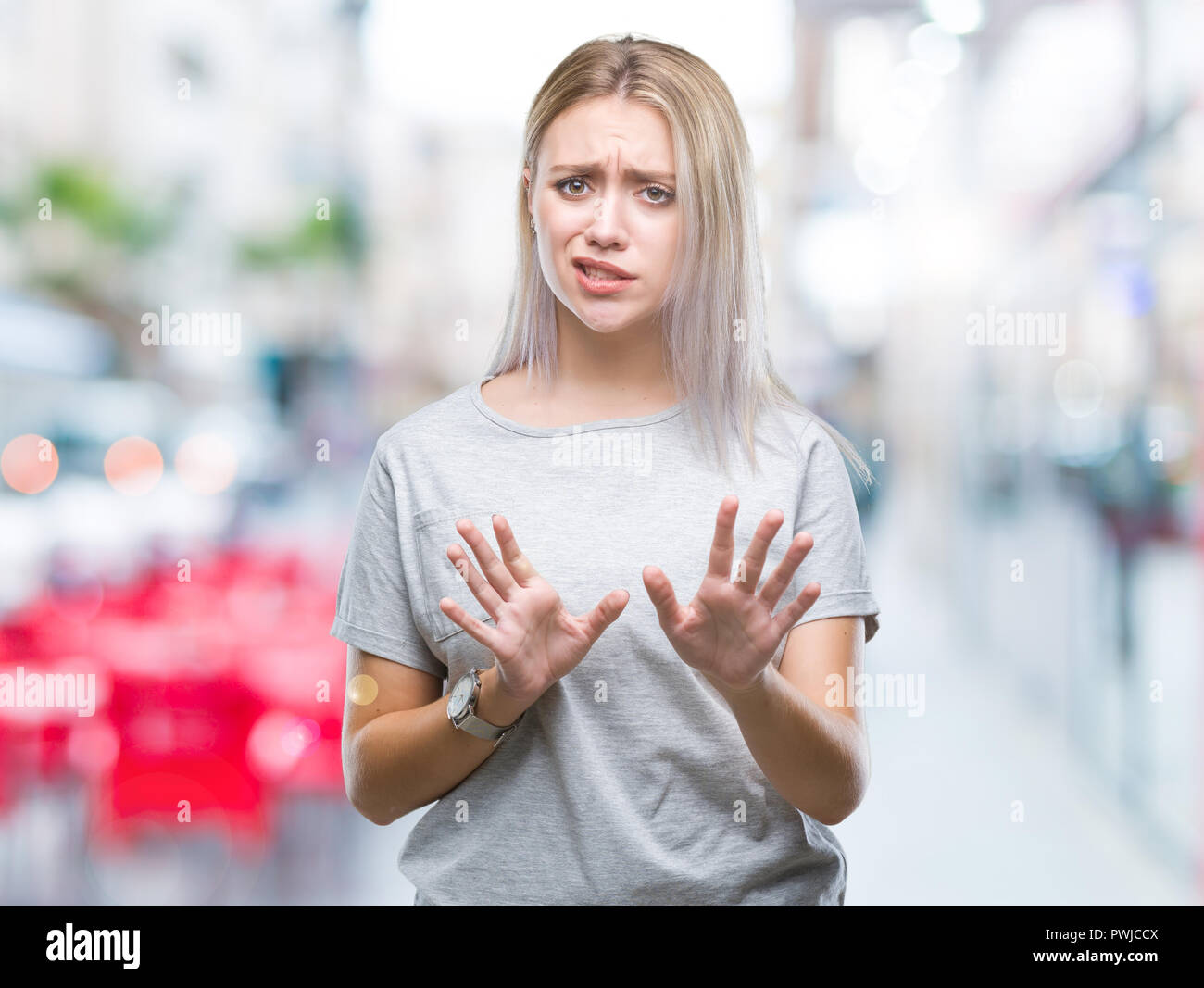 Young blonde woman over isolated background disgusted expression ...