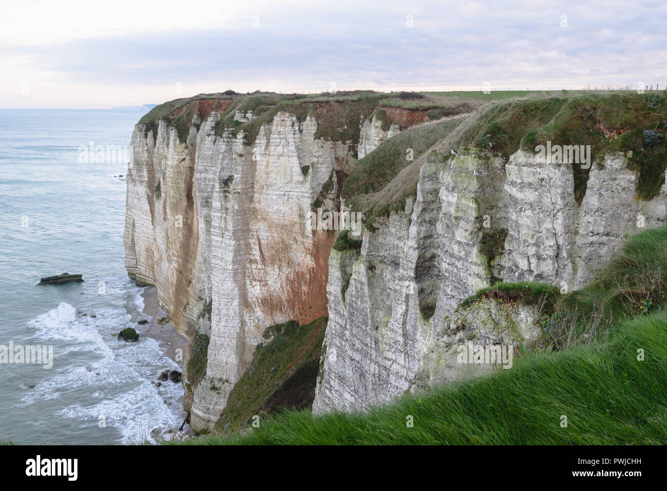 One windy and cold morning on the cliffs in Normandy, France, famous ...