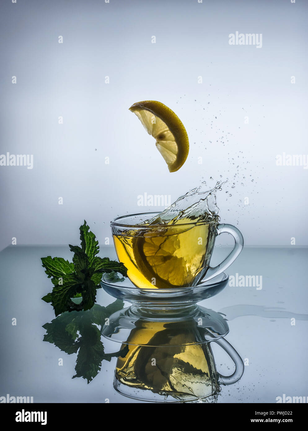 Cup of tea with lemon and splash Stock Photo - Alamy