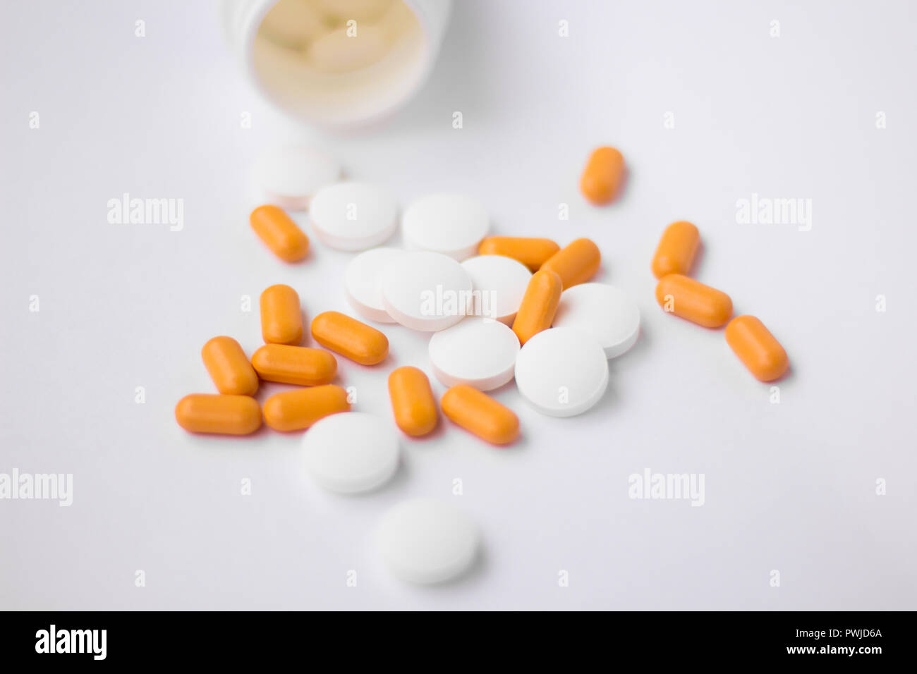 pills on white background. A cure for pain. Health and medicine ...