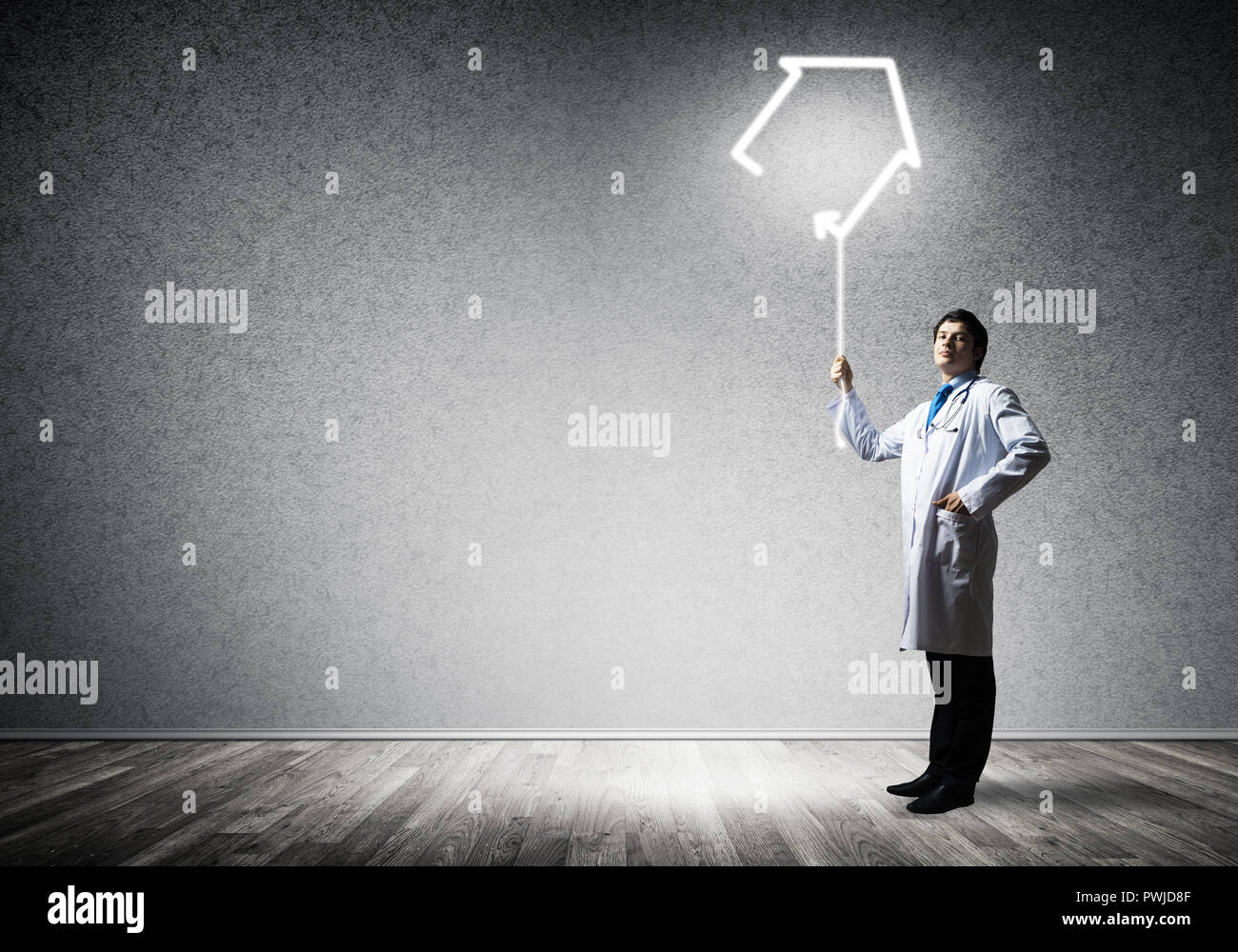 Doctor with house symbol Stock Photo - Alamy