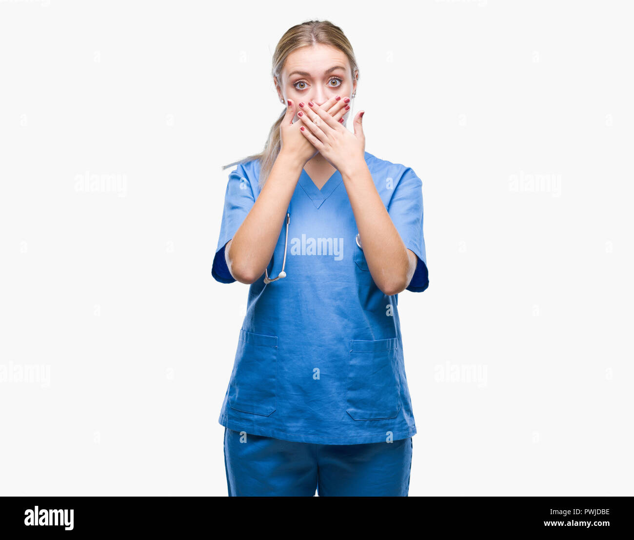 Young blonde surgeon doctor woman over isolated background shocked ...
