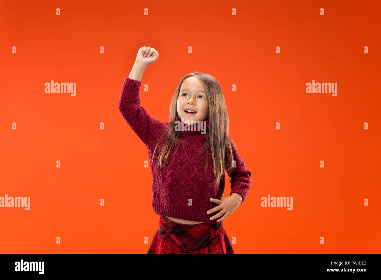 Happy teen girl standing, smiling isolated on trendy studio background ... Happy teen girl standing, smiling isolated on trendy studio background ...