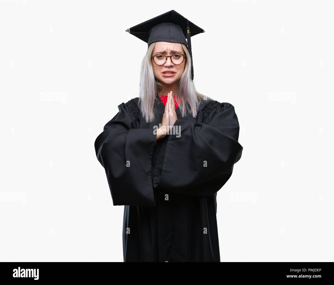 Young blonde woman wearing graduate uniform over isolated background ...
