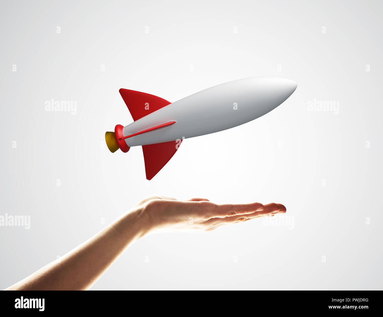 Rocket in hand as symbol for high technologies and science Stock Photo ...