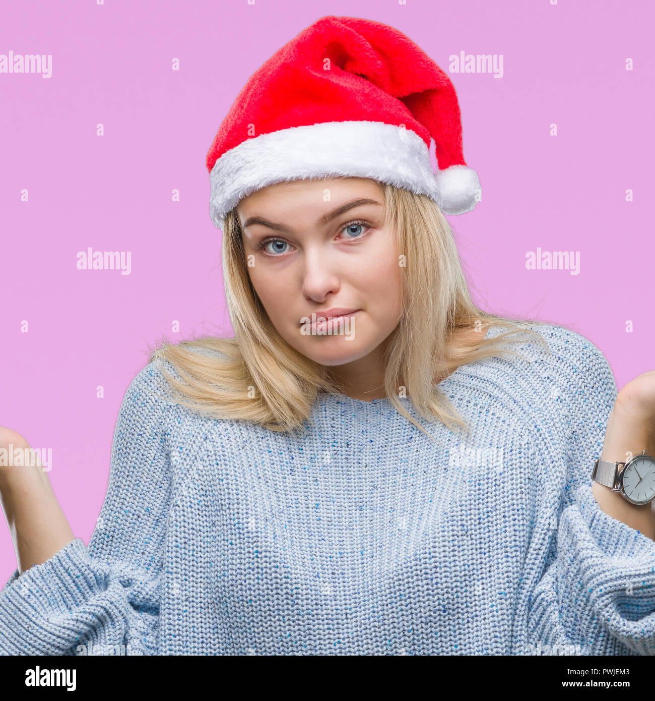 Young caucasian woman wearing christmas hat over isolated background ...