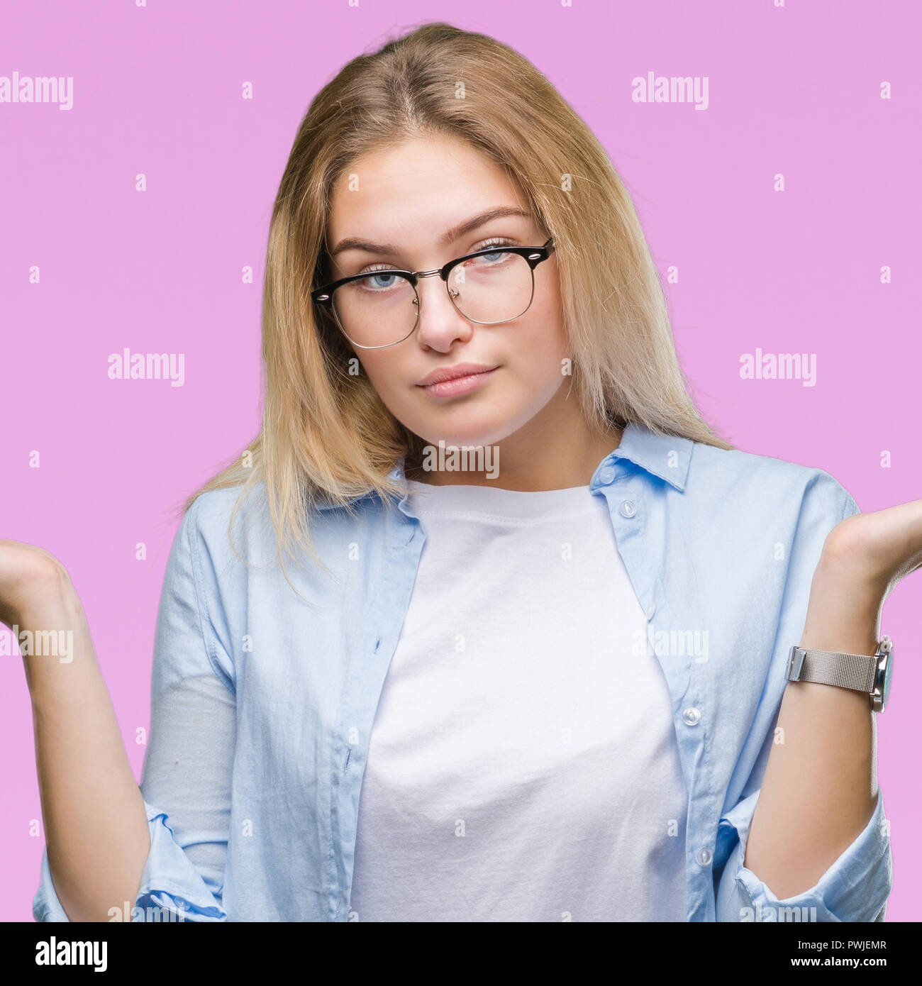 Young caucasian business woman wearing glasses over isolated background ...