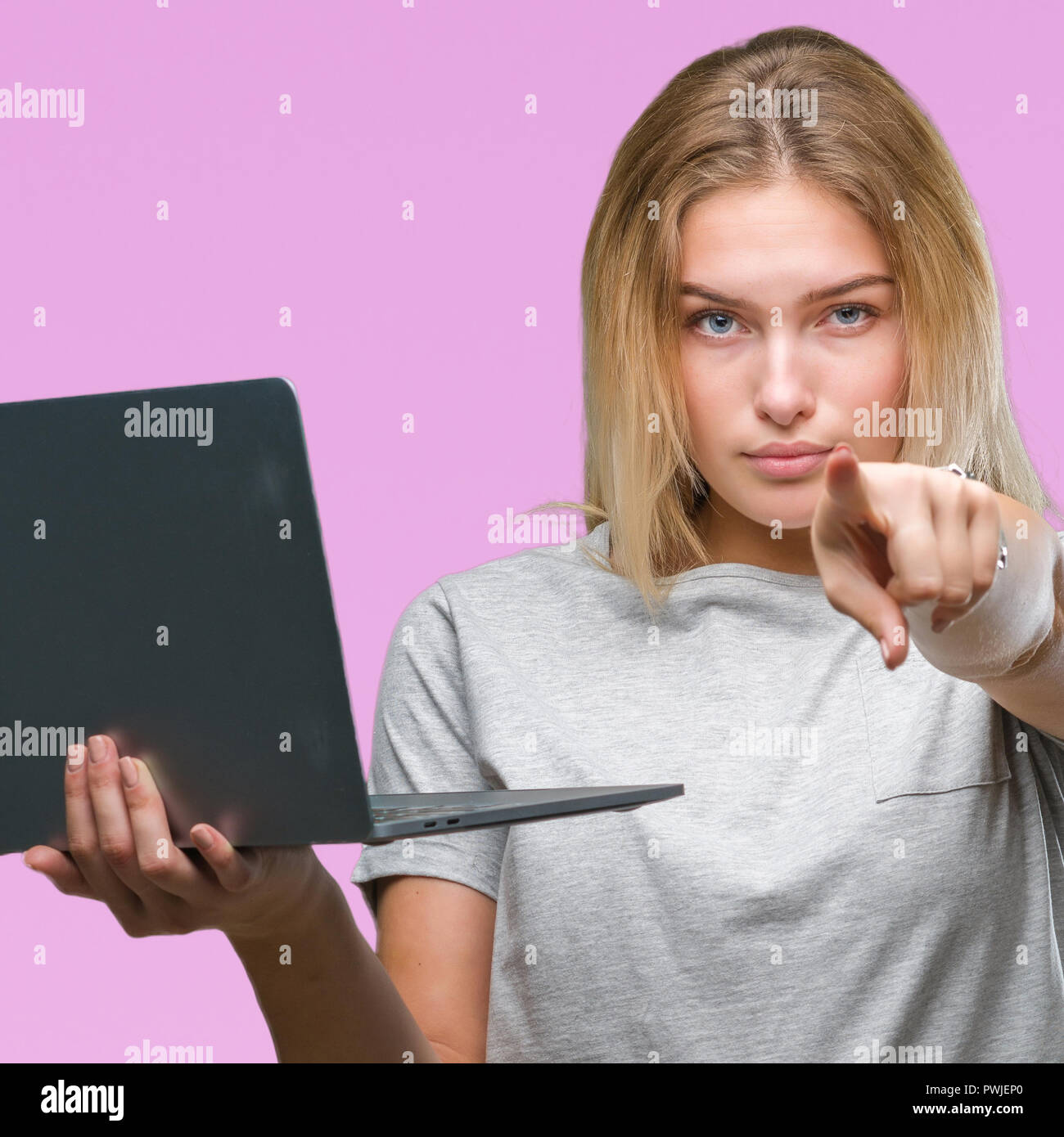 Young caucasian woman using computer laptop over isolated background ...
