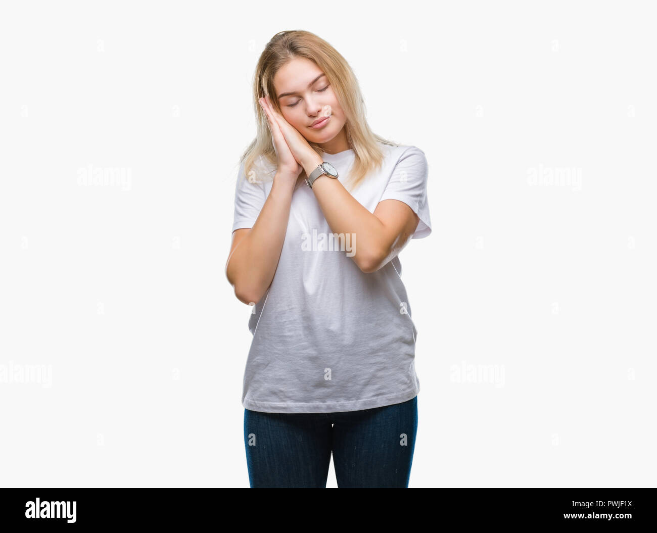 Young caucasian woman over isolated background sleeping tired dreaming ...