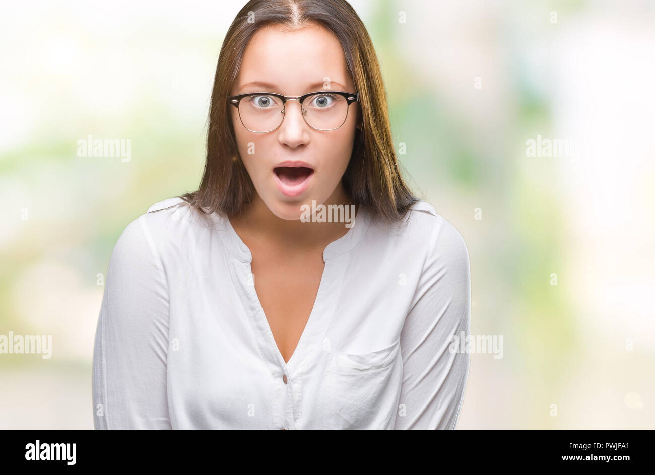 Young caucasian beautiful business woman wearing glasses over isolated ...