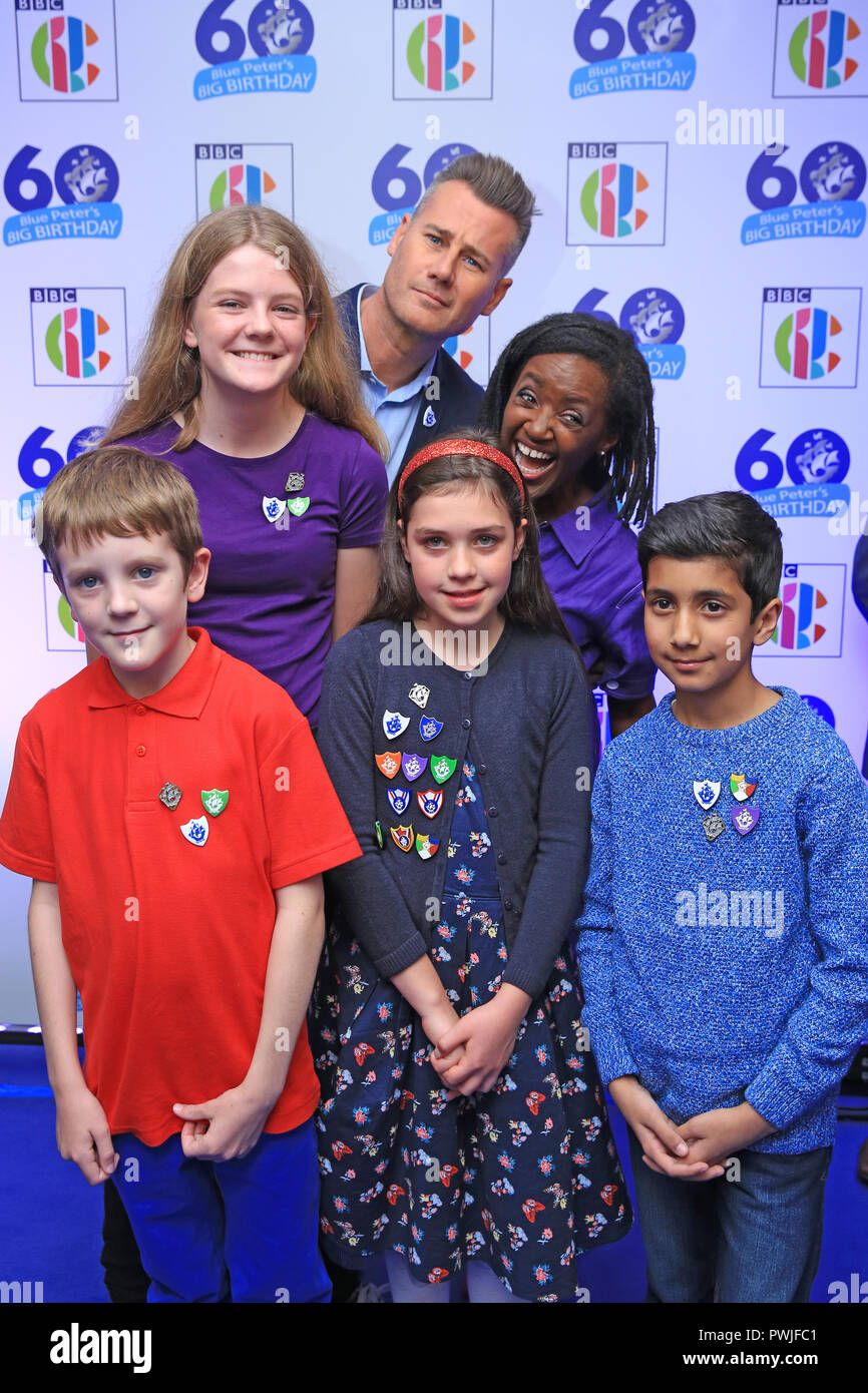 (Back) Tim Vincent and Diane-Louise Jordan with children wearing Blue ...