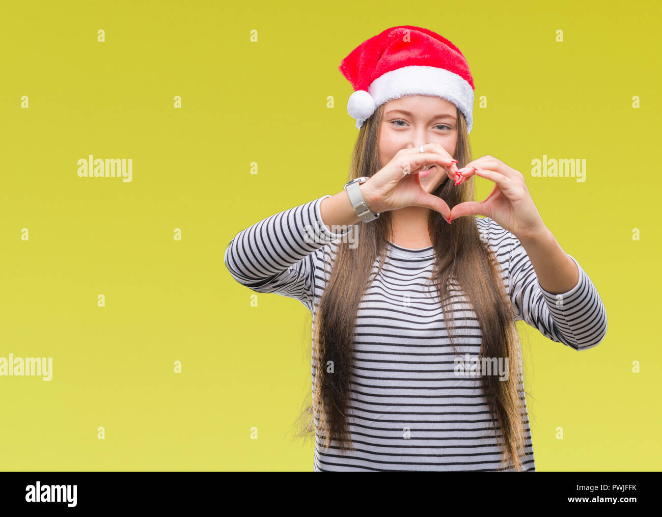 Young Beautiful Caucasian Woman Wearing Christmas Hat Over Isolated