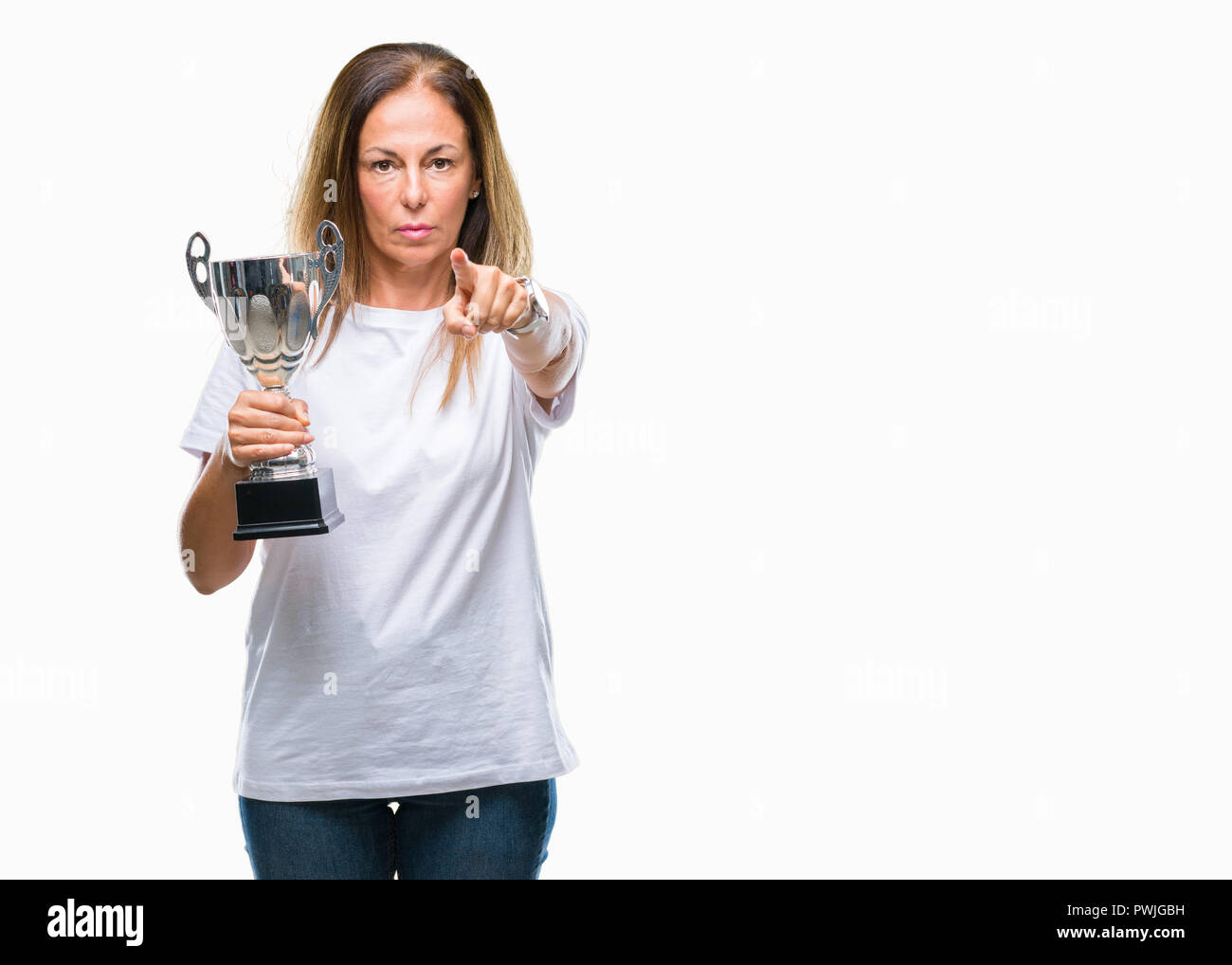 Middle age hispanic winner woman celebrating award holding trophy over ...