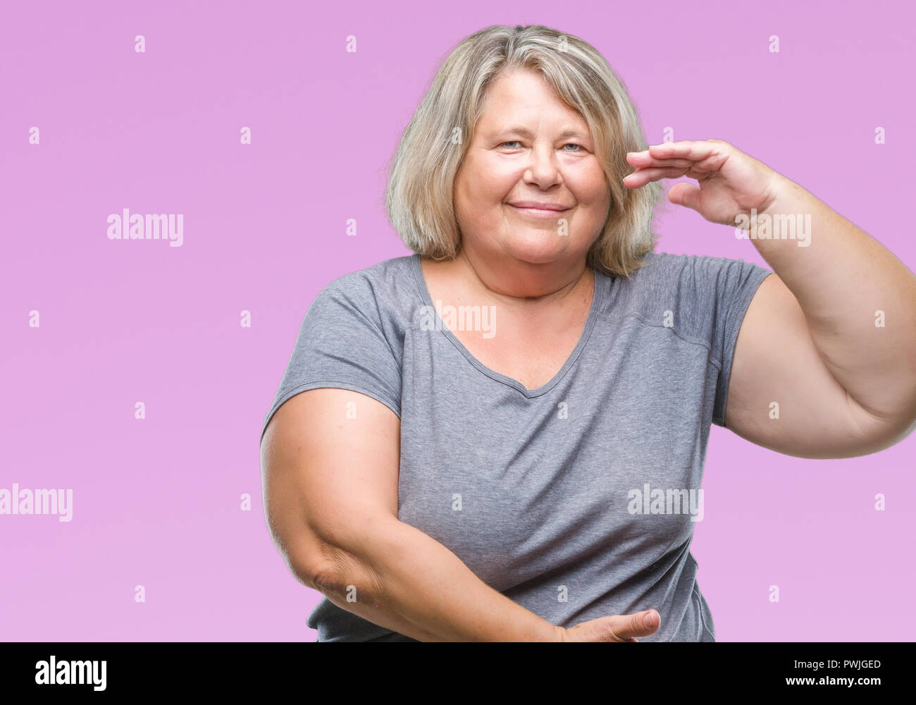 Senior plus size caucasian woman over isolated background gesturing ...