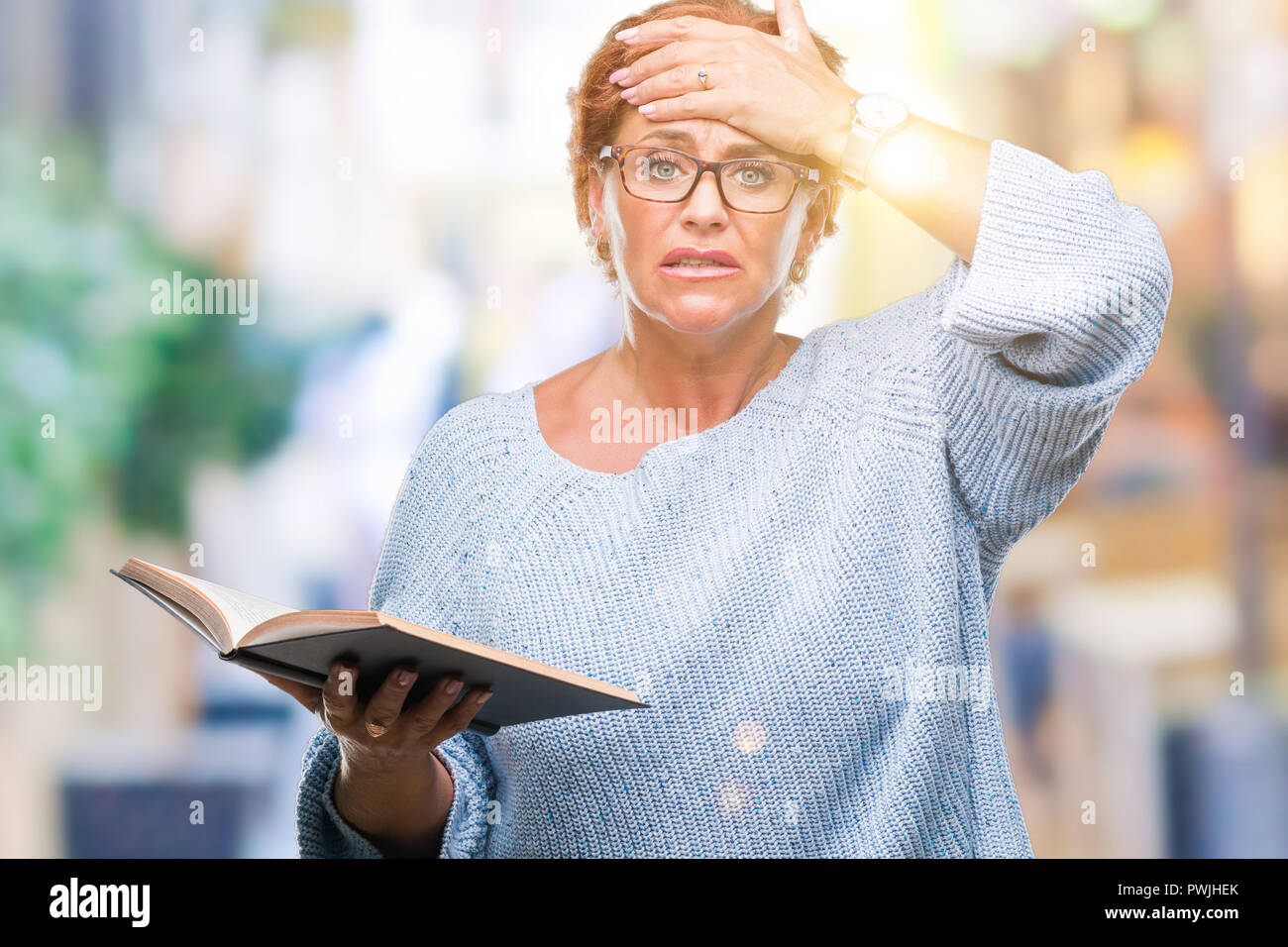 Woman shock reading book library hi-res stock photography and images ...
