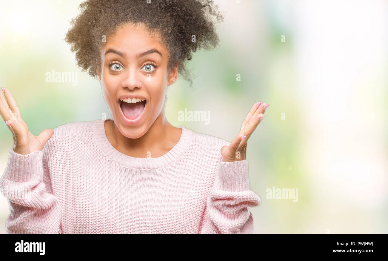 Young afro american woman wearing winter sweater over isolated ...