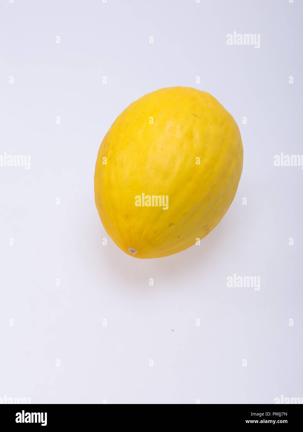 Ripe yellow melon isolated on white background Stock Photo - Alamy
