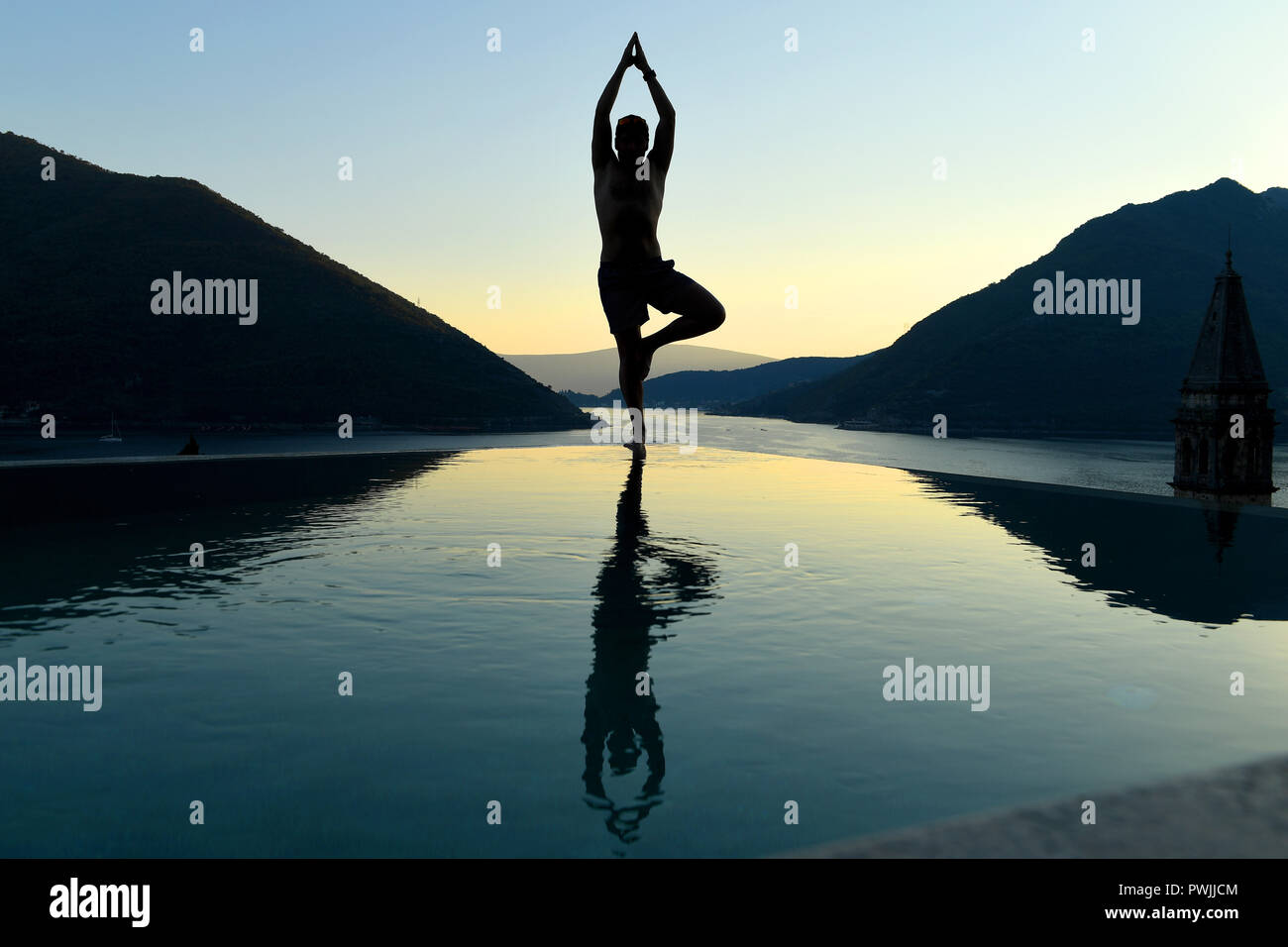 Yoga pose on Infinity pool at Kotor on Montenegro’s Adriatic coast ...