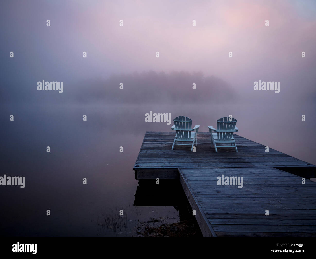 Dock and muskoka chairs on lake muskoka hi-res stock photography and ...