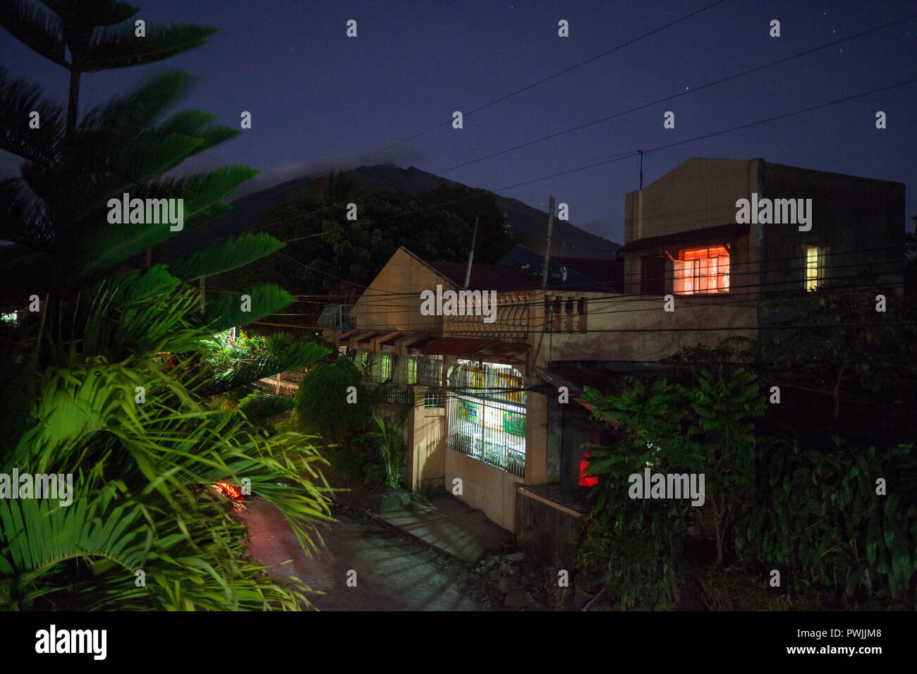 Nighttime view of a house and mountain in Naga City, Philippines Stock ...