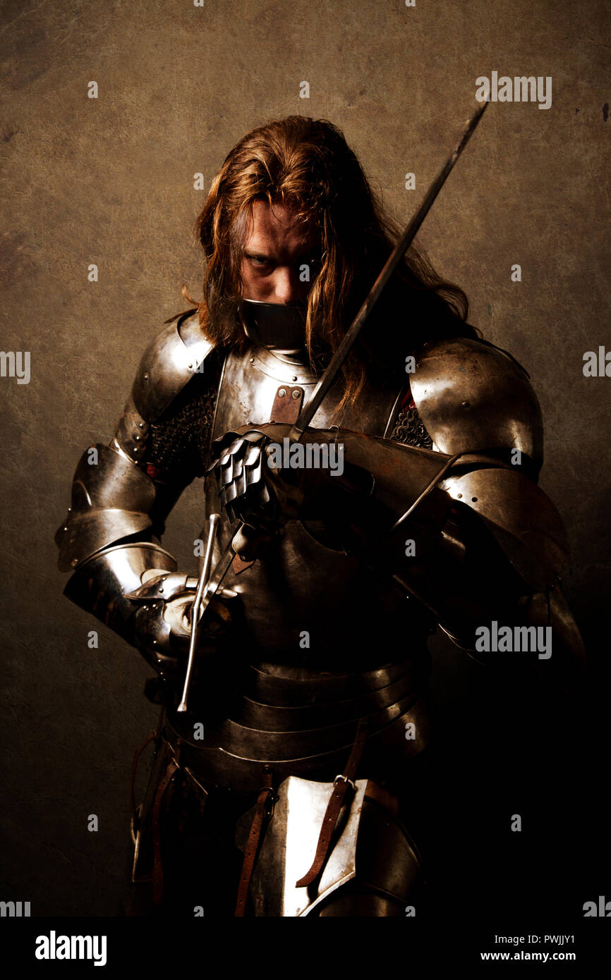 Portrait of a knight in armor, long hair Stock Photo - Alamy