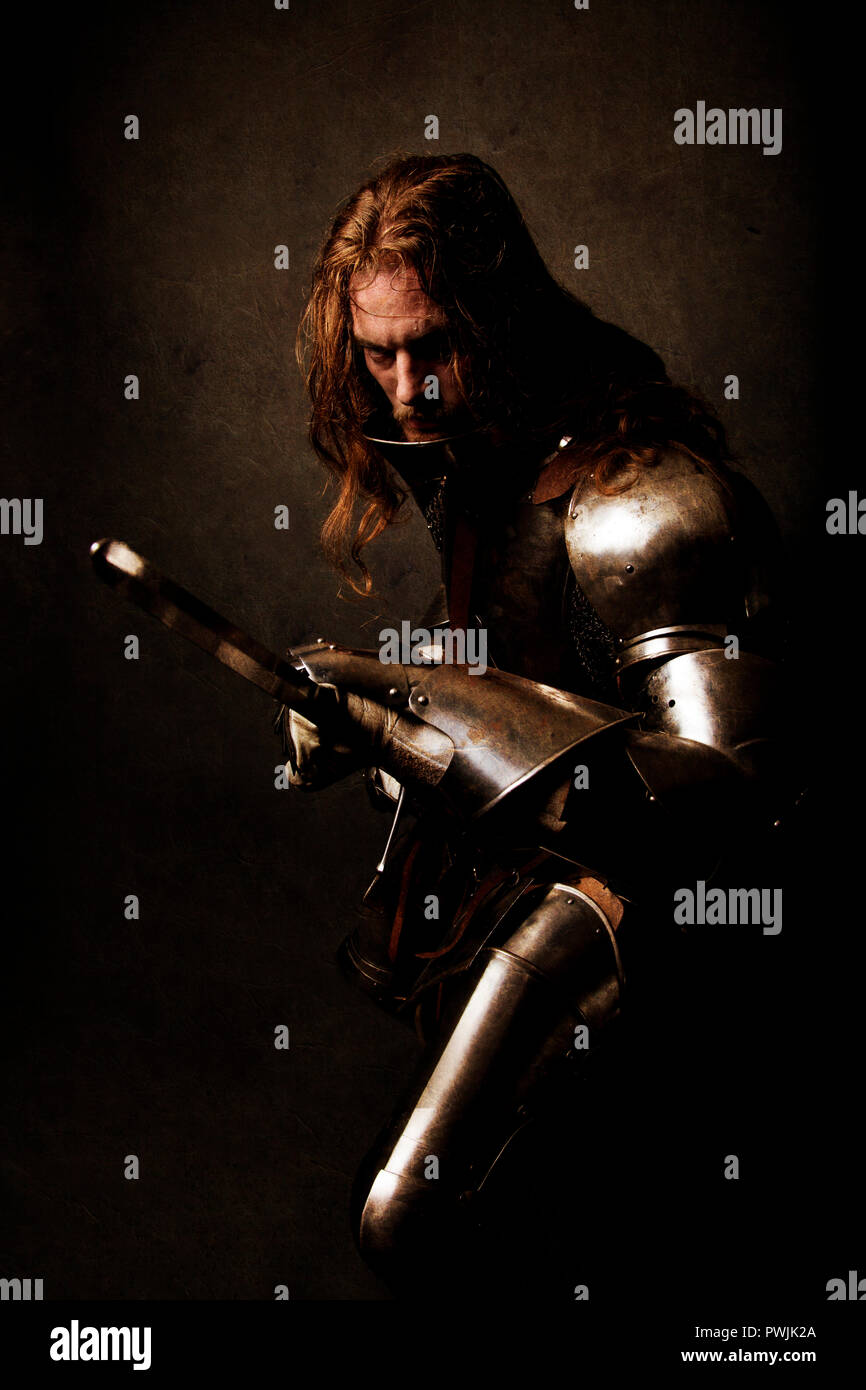Portrait of a knight in armor, long hair Stock Photo - Alamy
