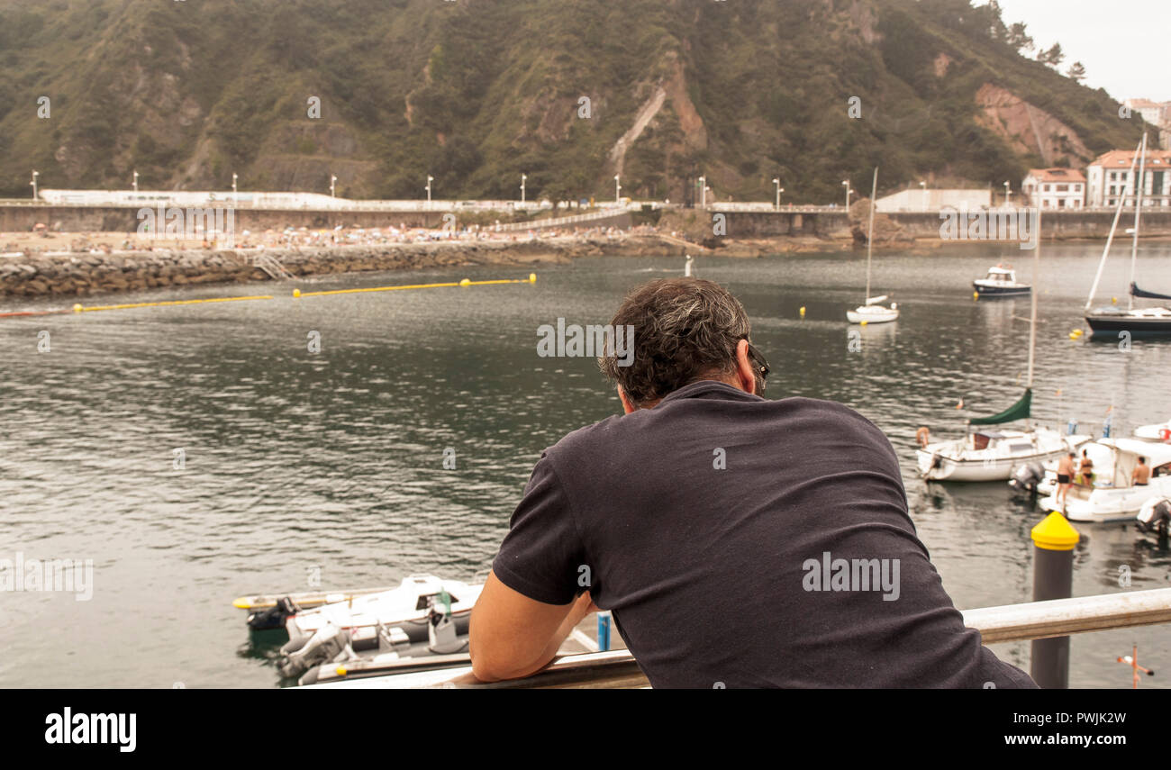 man looking at the port Stock Photo - Alamy