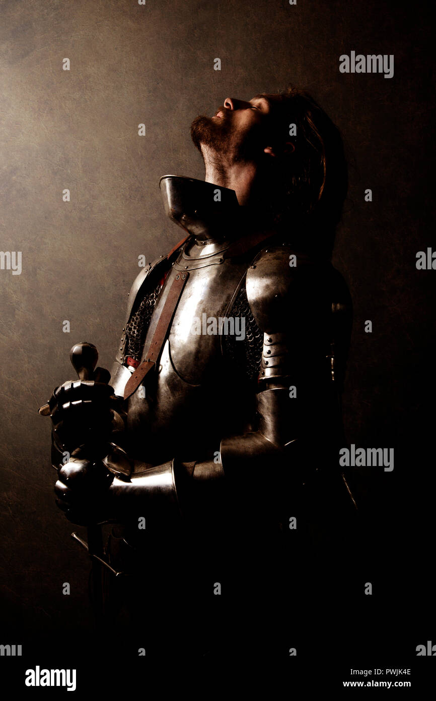 Portrait of a knight in armor, long hair Stock Photo - Alamy
