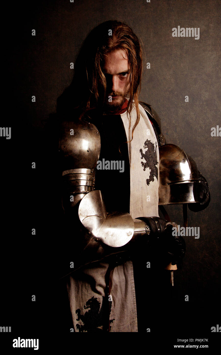 Portrait of a knight in armor, long hair Stock Photo - Alamy
