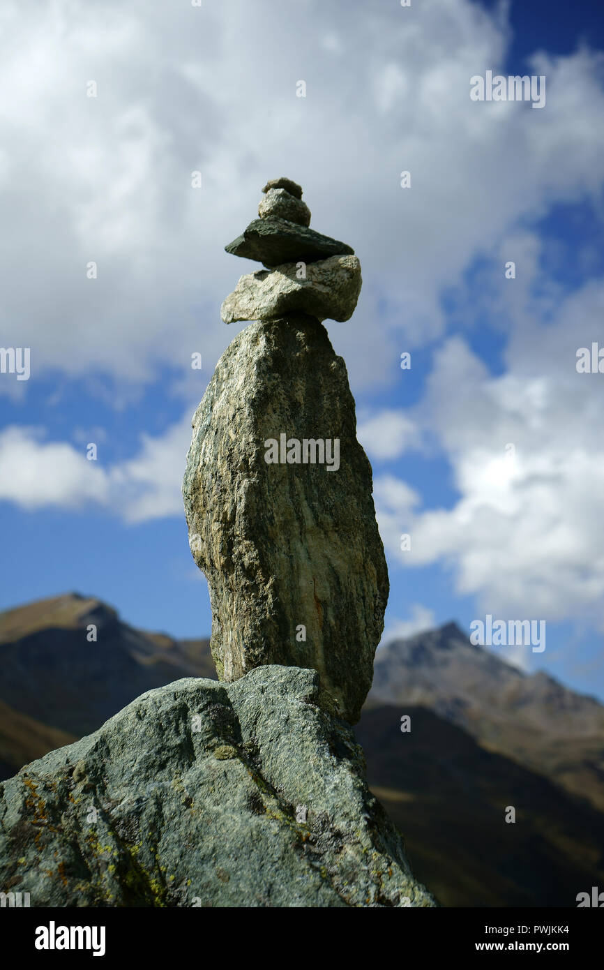 Rock cairn balancing on boulder, Moiry glacier, Valais alps ...