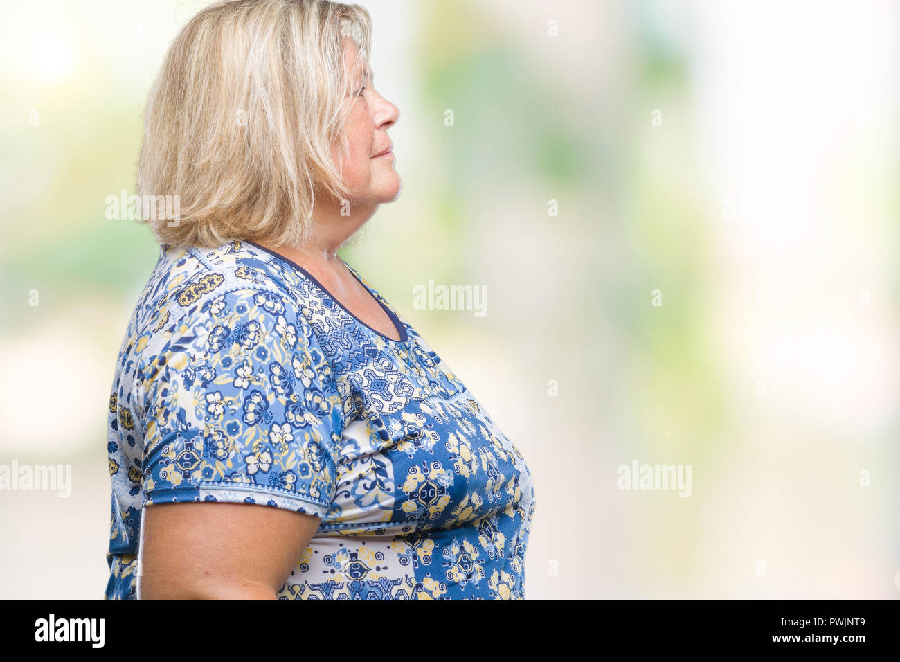Senior plus size caucasian woman over isolated background looking to ...
