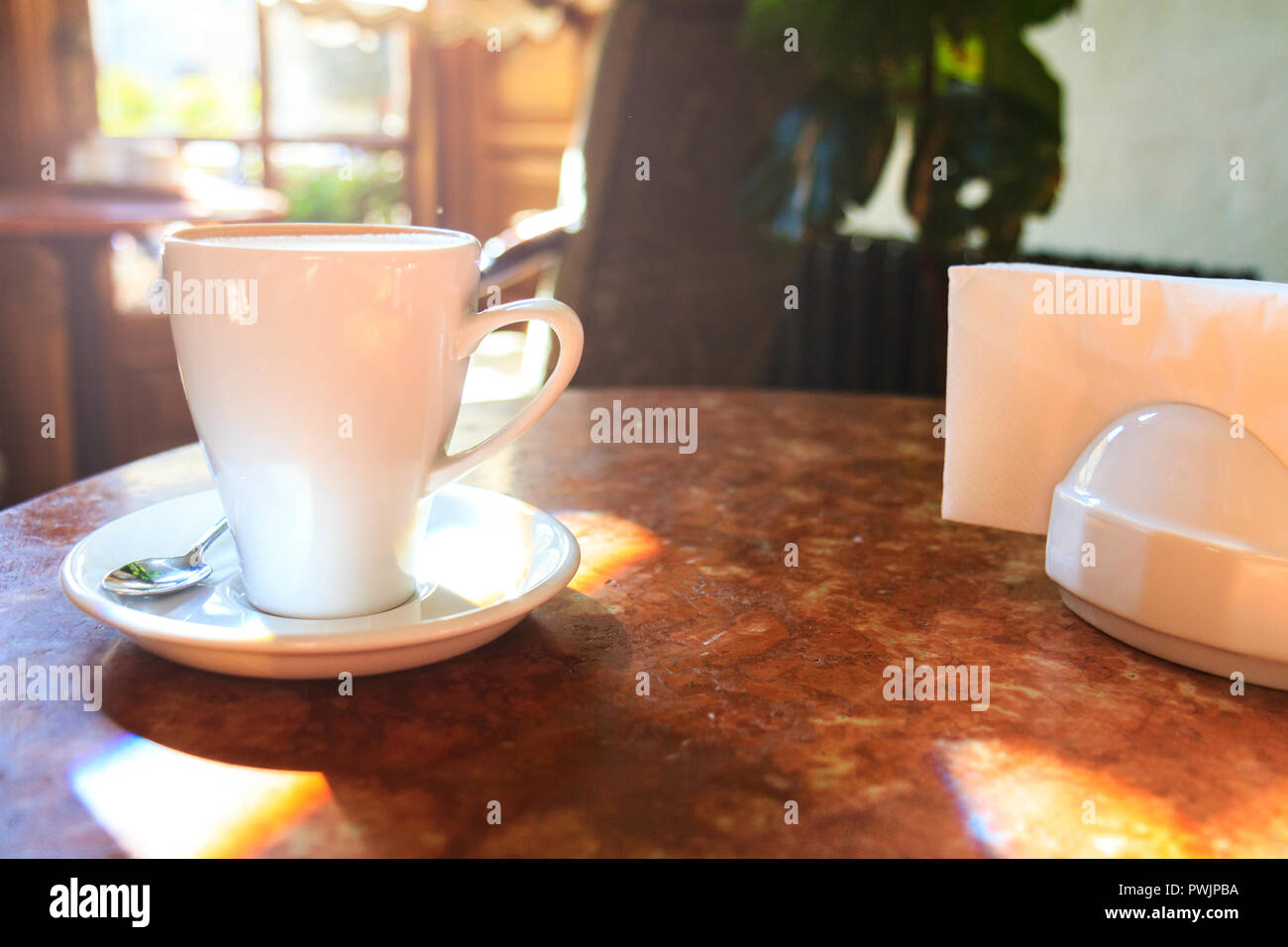 morning coffee in front of the sunny window Stock Photo - Alamy