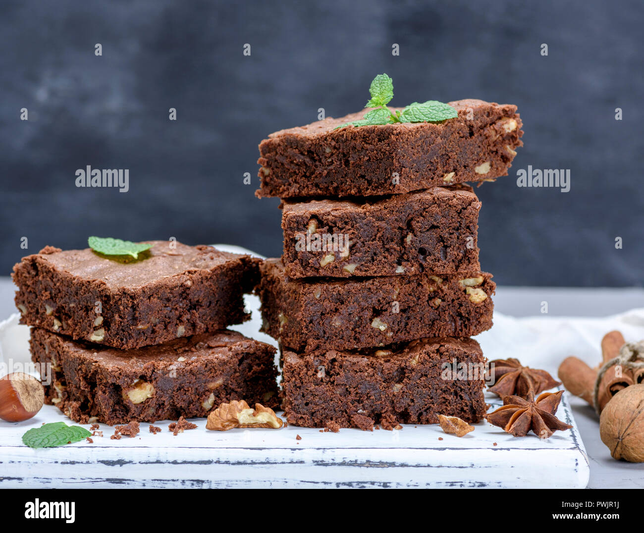stack of baked square pieces of brownie pie, close up Stock Photo - Alamy