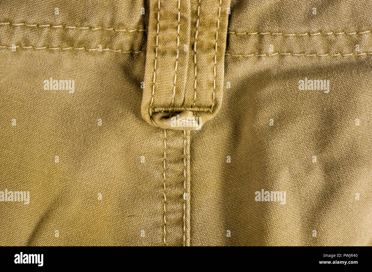 clothing items washed cotton fabric texture with seams, macro, close-up ...