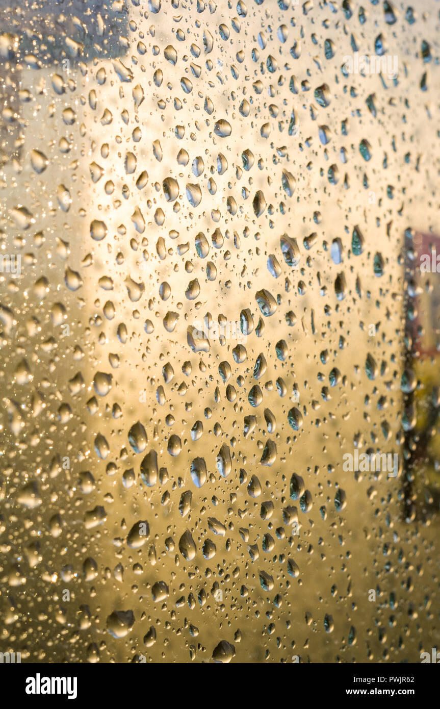 background of raindrops on window glass, toned, close-up Stock Photo ...