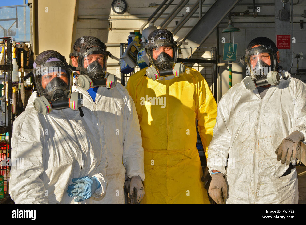 Extremely dangerous materials handling and clean up Stock Photo - Alamy