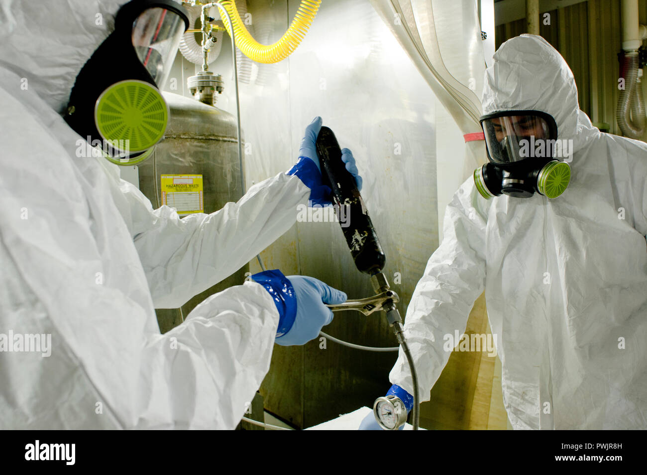 Extremely dangerous materials handling and clean up Stock Photo - Alamy