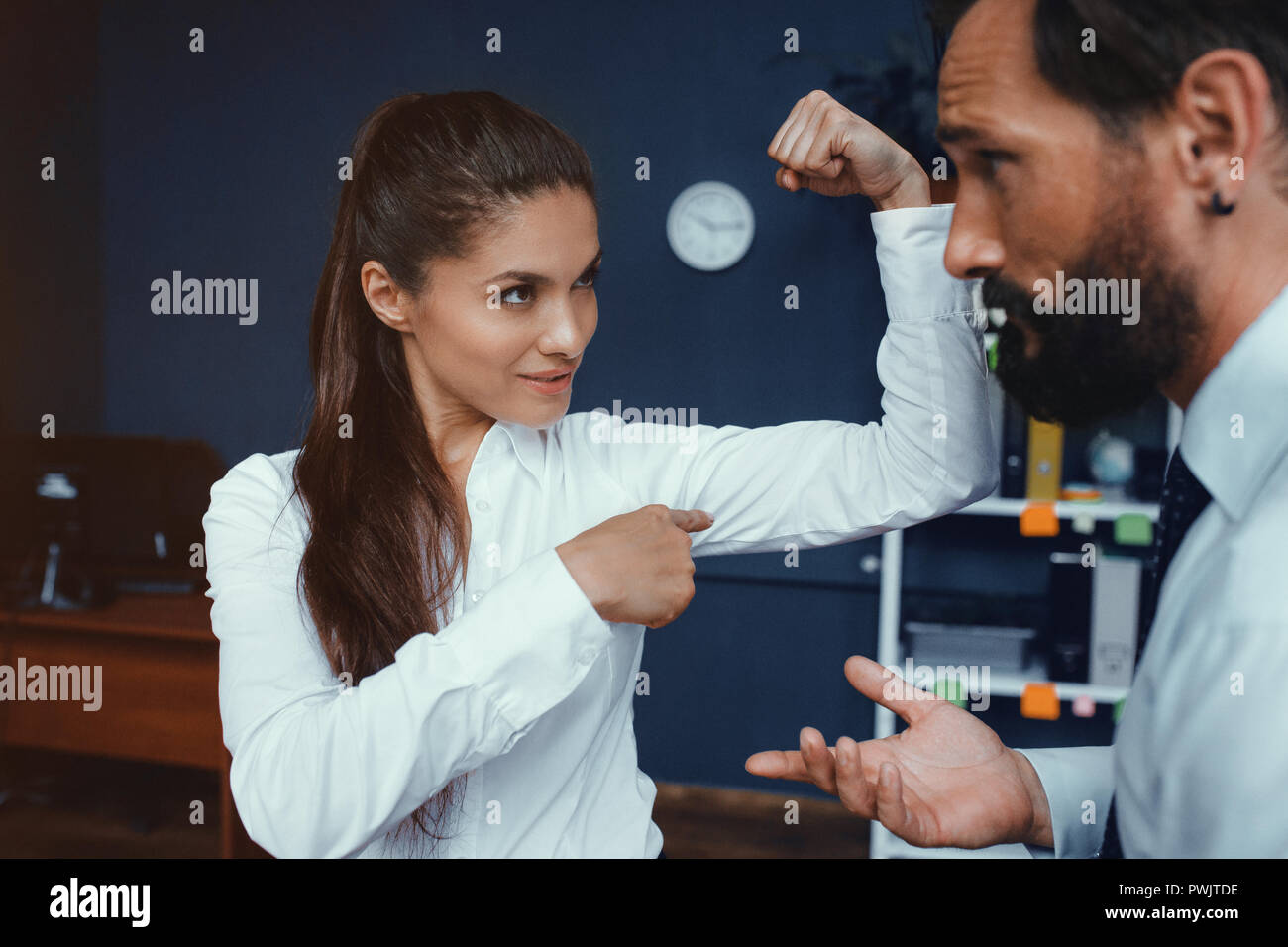 Business people showing muscles hi-res stock photography and images - Alamy