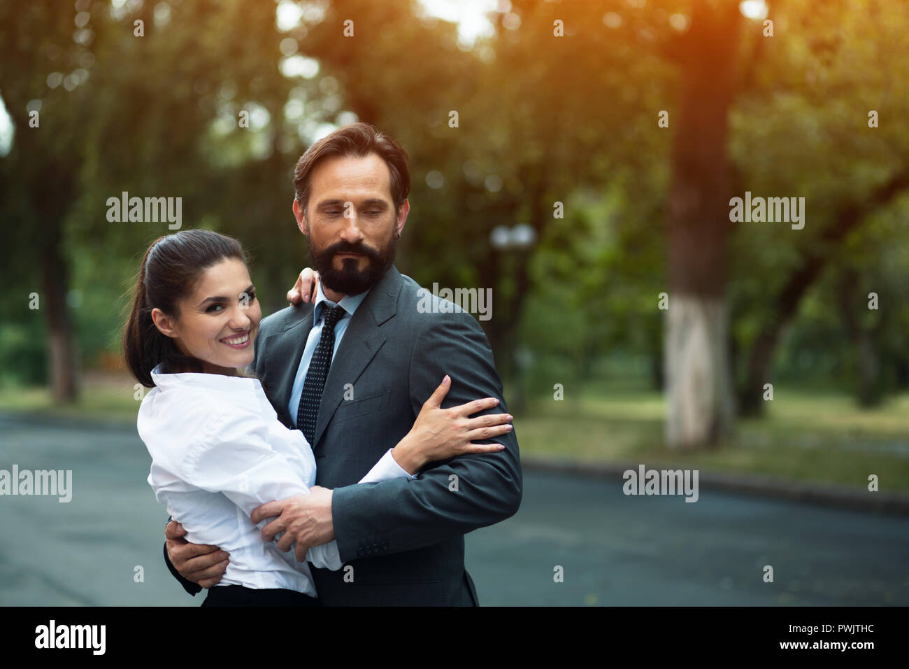 Modern two young business people stand outside Stock Photo - Alamy