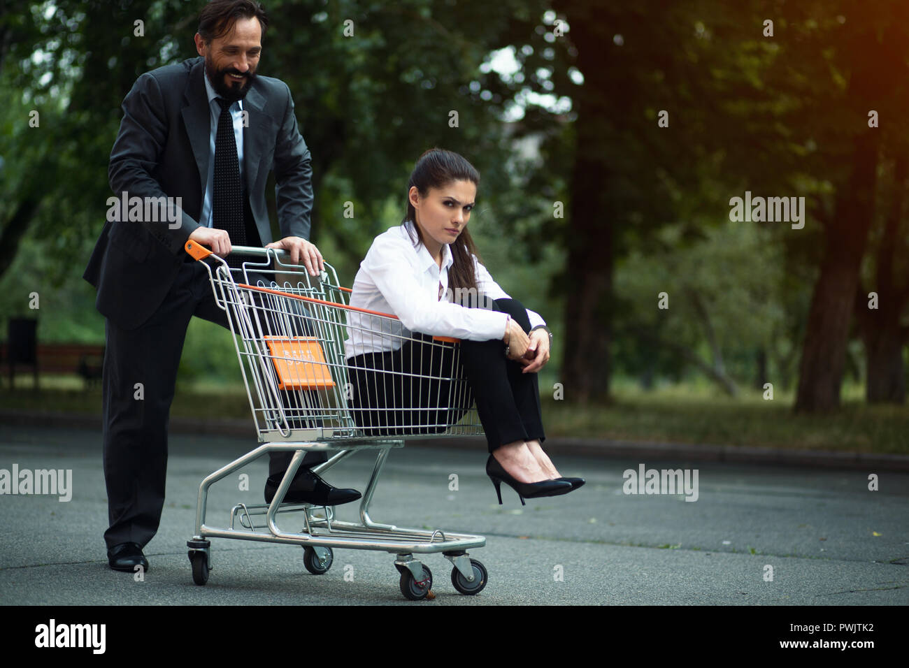 business woman sitting in cart Stock Photo - Alamy