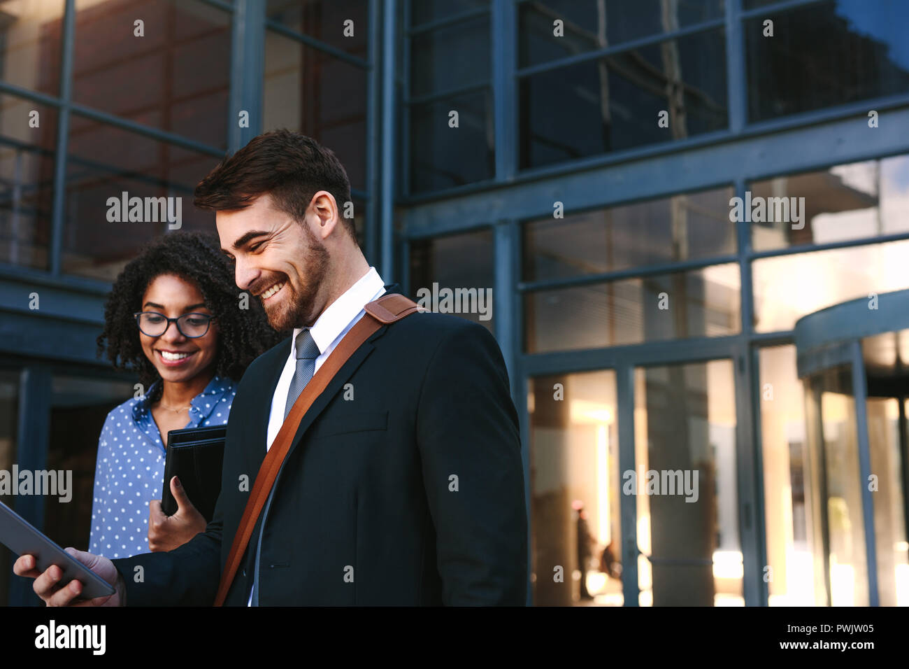 Business woman walking out office building hi-res stock photography and ...