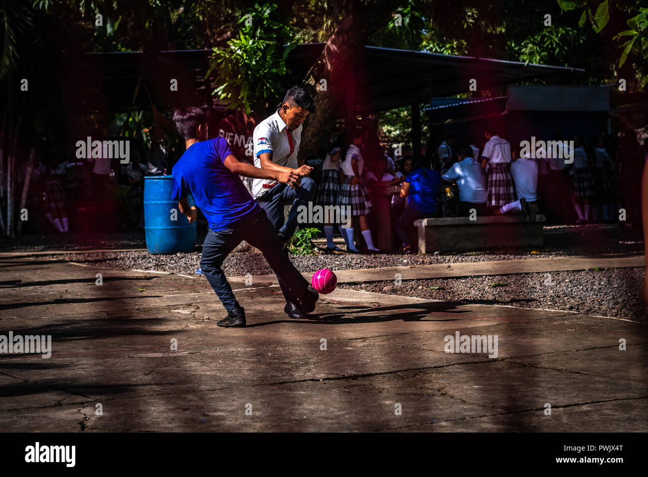 guatemalan kids playing soccer at recess at guatemalan college Stock ...