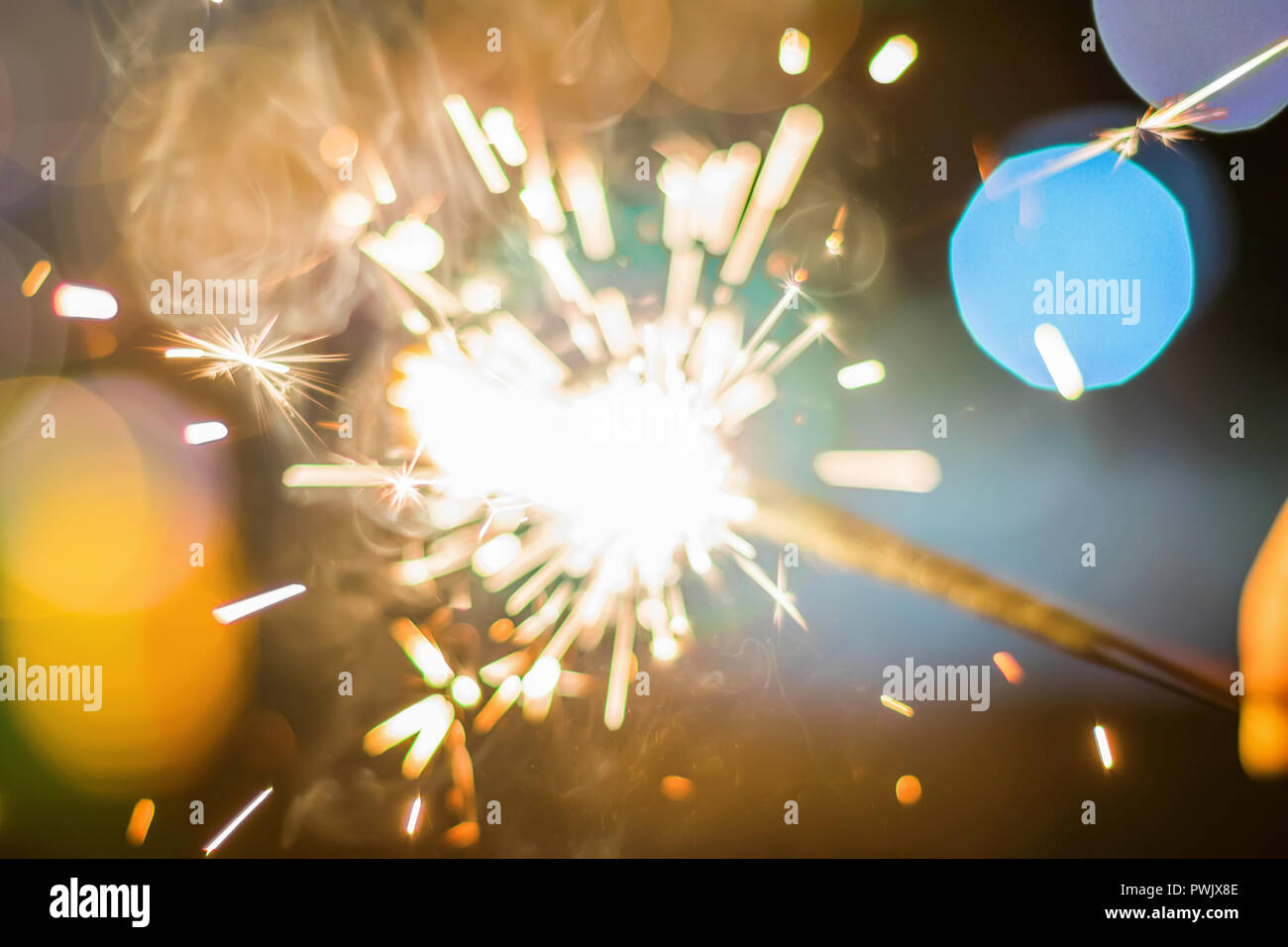 Sparkler Bokeh Colorful sparkler. Night background with a sparkler ...