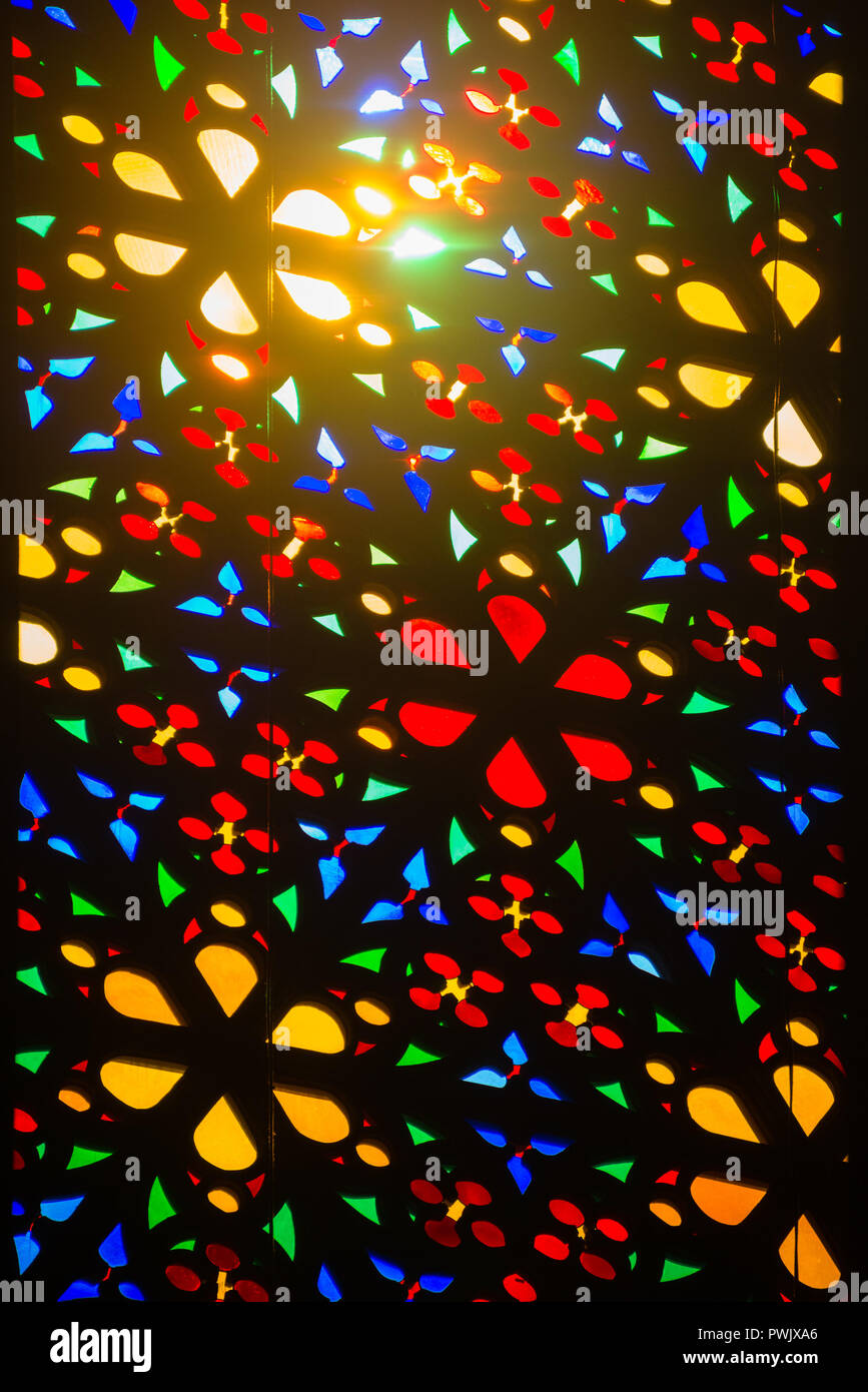 Multi colored stained glass window with flower prints Stock Photo - Alamy