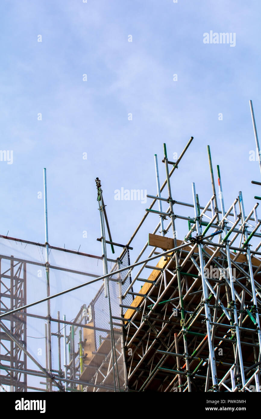 Scaffolding on exterior of building at construction site Stock Photo ...