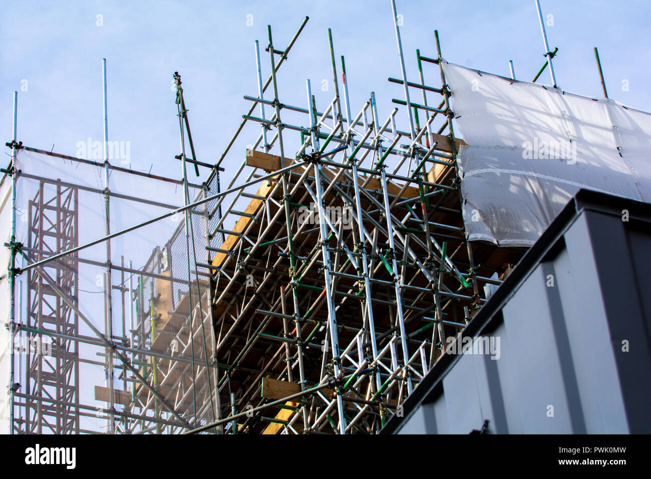 Scaffolding on exterior of building at construction site Stock Photo ...